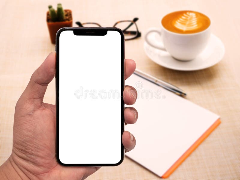 Hand Using Smartphone White Screen with Workspace on Wood Table. Stock ...