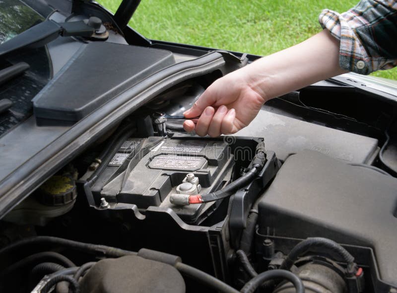 Loosening a Nut on a Car Battery Retaining Bracket Stock Image - Image ...