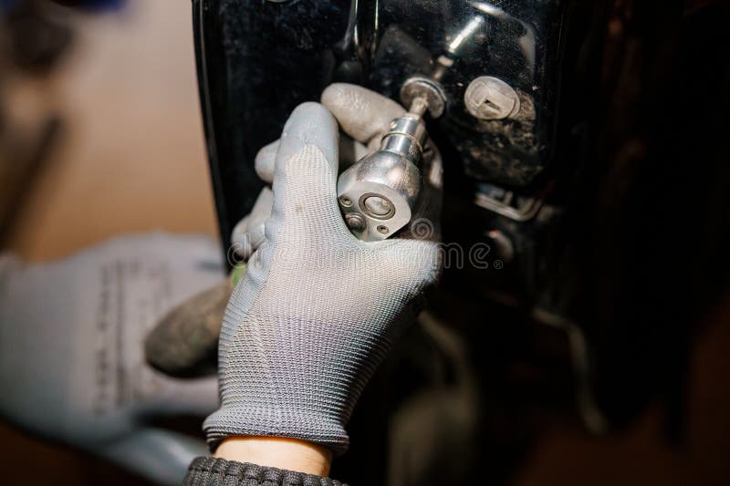 Hand Using a Socket Wrench To Repair a Vehicle Component Stock Photo ...