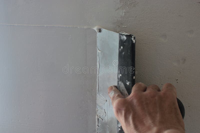Hand a Spatula, Level the Putty on the Wall. Stock Photo - Image of ...