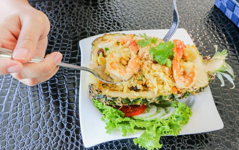 The Hand is Using a Spoon To Scoop the Fried Rice Stock Image - Image ...