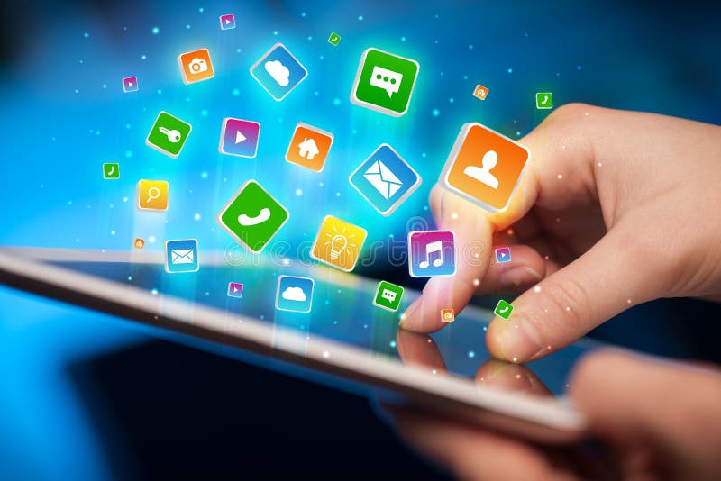 Hand Using Tablet with Application Icons Flying Around Stock Image ...