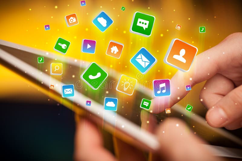 Hand Using Tablet with Application Icons Flying Around Stock Image ...