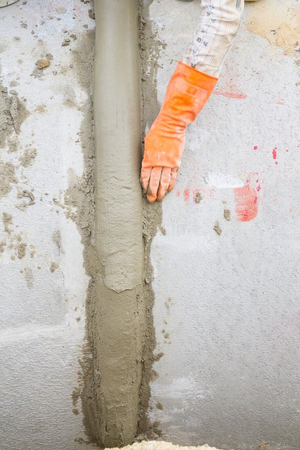 Hand Using Trowel To Finish on Concrete Drainage Pipe Stock Photo ...