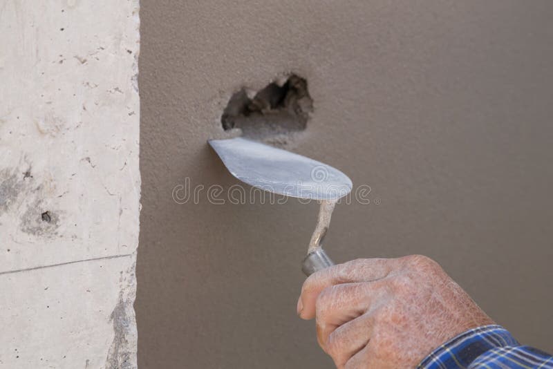Hand Using Trowel To Finish Wet Concrete Wall at Construction Si Stock ...