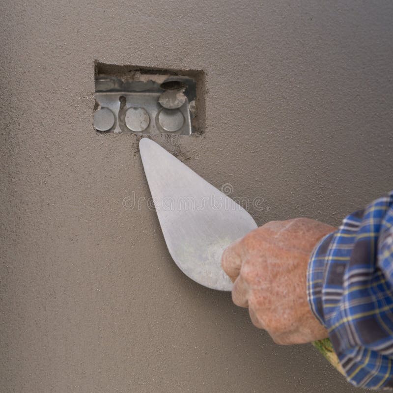 Hand Using Trowel To Finish Wet Concrete Wall at Construction Si Stock ...