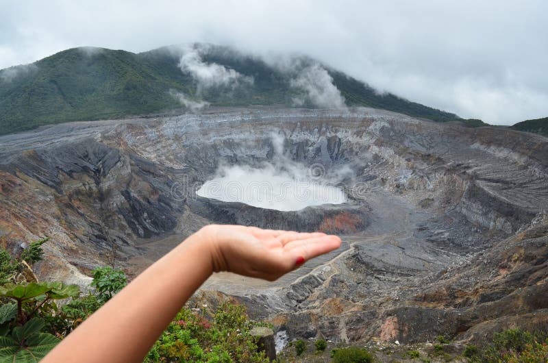 Hand and volcano stock image. Image of natural, plants - 103851185