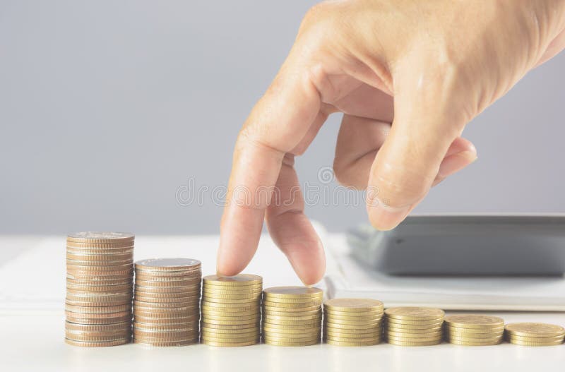 Hand Walking on Stack Coins on the Table. Financial and Growing Stock ...