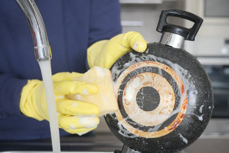 Hand washing a cooking pan stock image. Image of dishware - 281015495