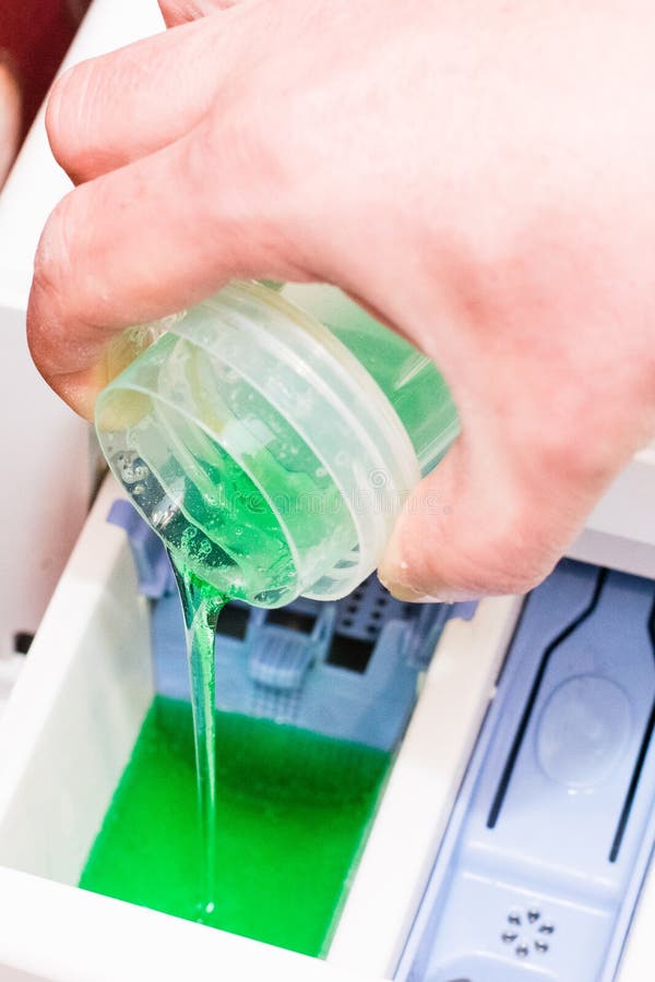 Hand with Washing Gel Close Up. the Man Pours the Washing Gel into the ...