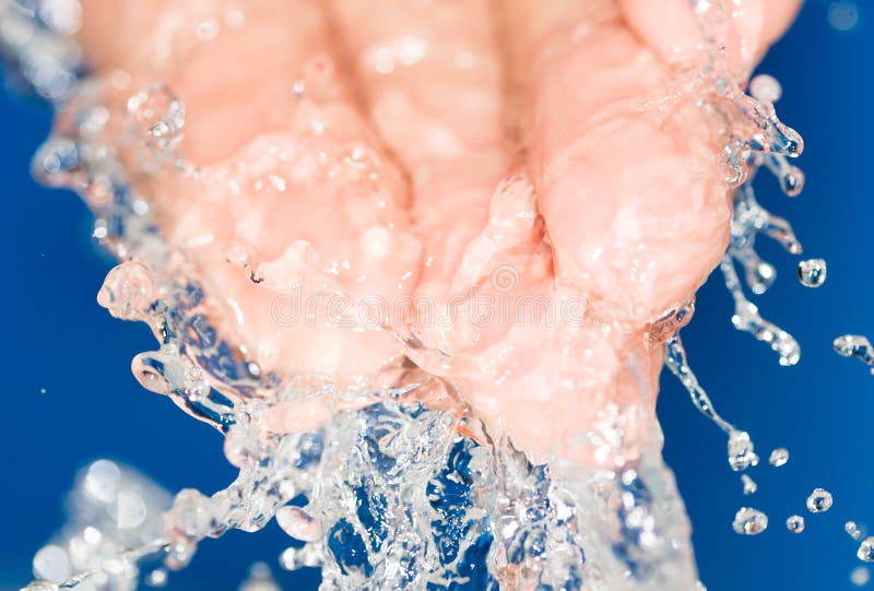 Hand in the Water on a Blue Background Stock Image - Image of ...
