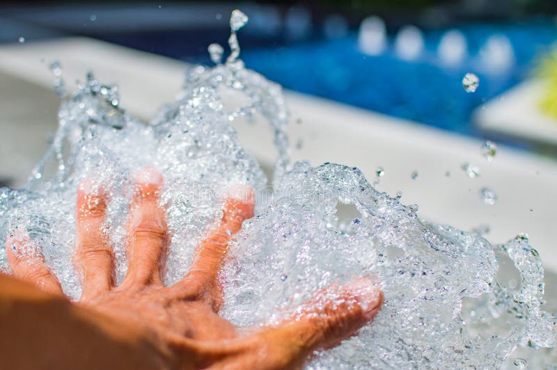 Hand with water splash stock image. Image of flowing - 98355545
