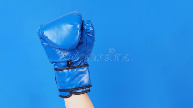 Hand Wear Blue Boxing Gloves on Blue Background Stock Photo - Image of ...