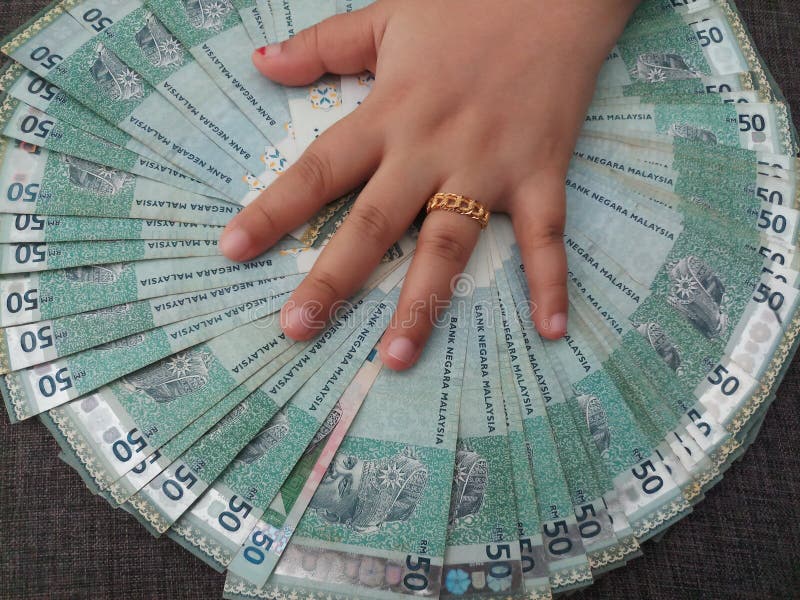 Hand Wear Gold Ring on Ringgit Malaysia. Stock Image - Image of gold ...