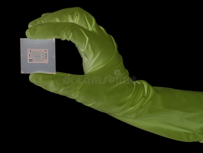 Hand Wearing Gloves Holding a CPU Computer Processor Microchip Stock ...