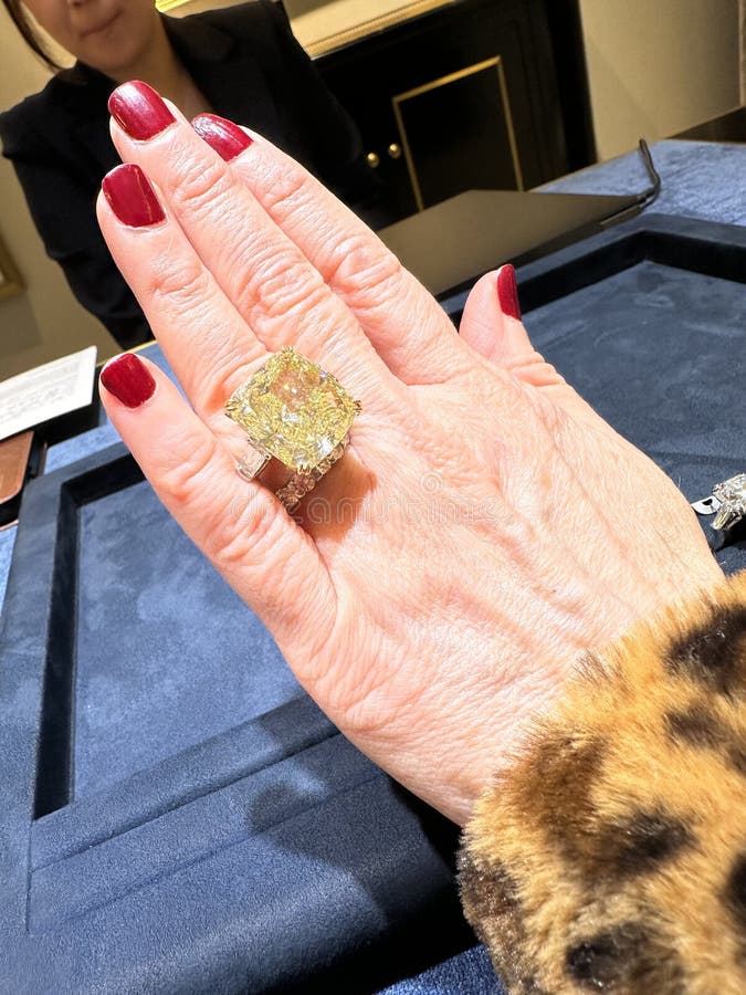 Statement Yellow Diamond Ring on Leopard Print Sleeve Stock Photo ...