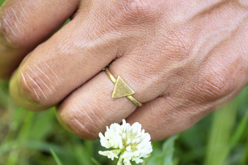 Hand Wearing Triangle Shape Metal Ring Stock Photo - Image of fingers ...