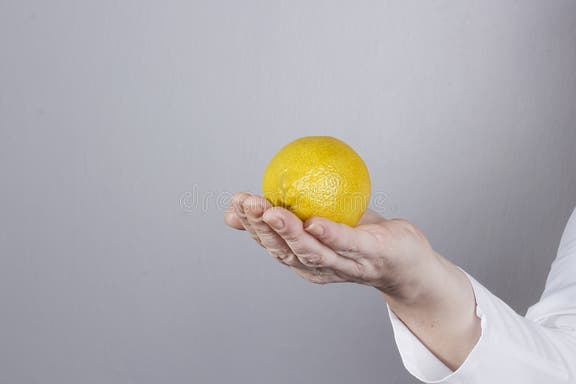 Hand with lemon stock image. Image of copy, diet, eating - 178394889