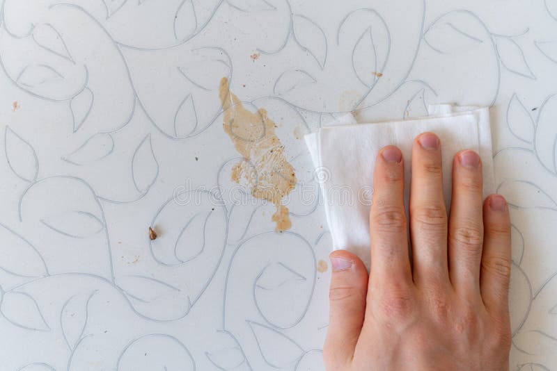 Hand with a White Rag Wiping the Dirty Table Surface in Kitchen at Home ...