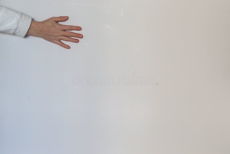 Hand on the White Wall from Left Stock Photo - Image of left, floor ...
