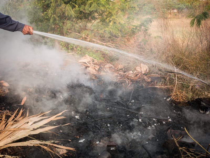 The Hand Who Extinguish Fire with Water Stock Photo - Image of close ...
