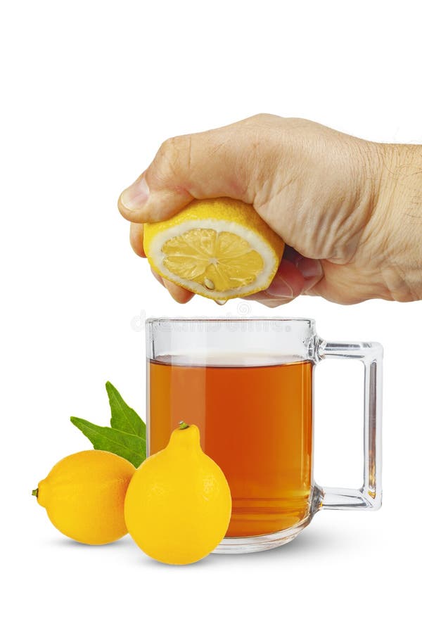 The Hand Will Squeeze the Lemon Juice into a Cup of Tea Stock Image ...