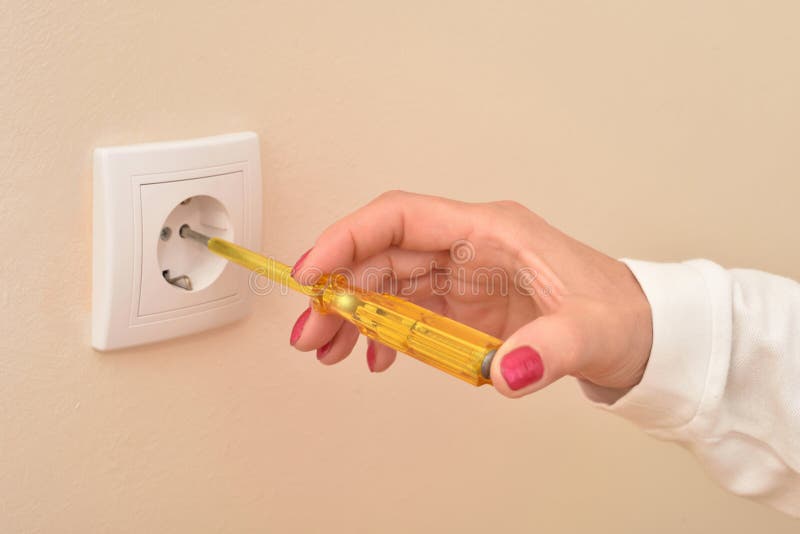 Hand of a Woman Holding and Checking Power Socket with Electrical ...