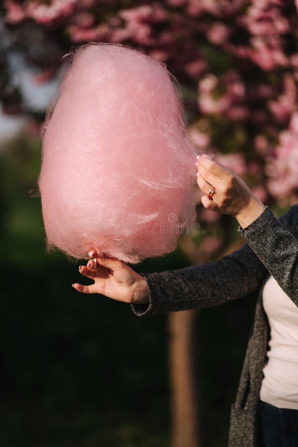 Hand of Woman Holding a Pink Cotton Candy Stock Image - Image of candy ...