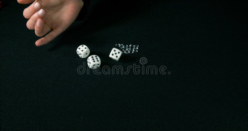 Hand of Woman Throwing Dice with Diamonds Against Black Background ...