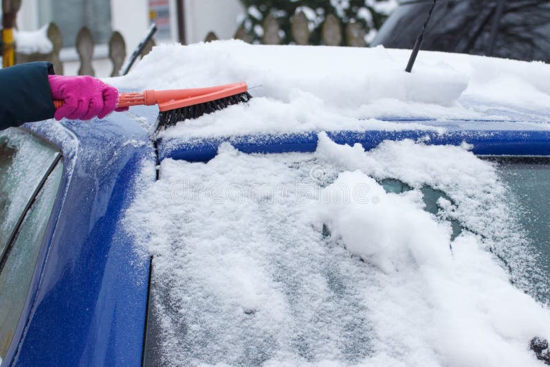 Hand of Woman Using Brush and Remove Snow from Car and Windscreen Stock ...
