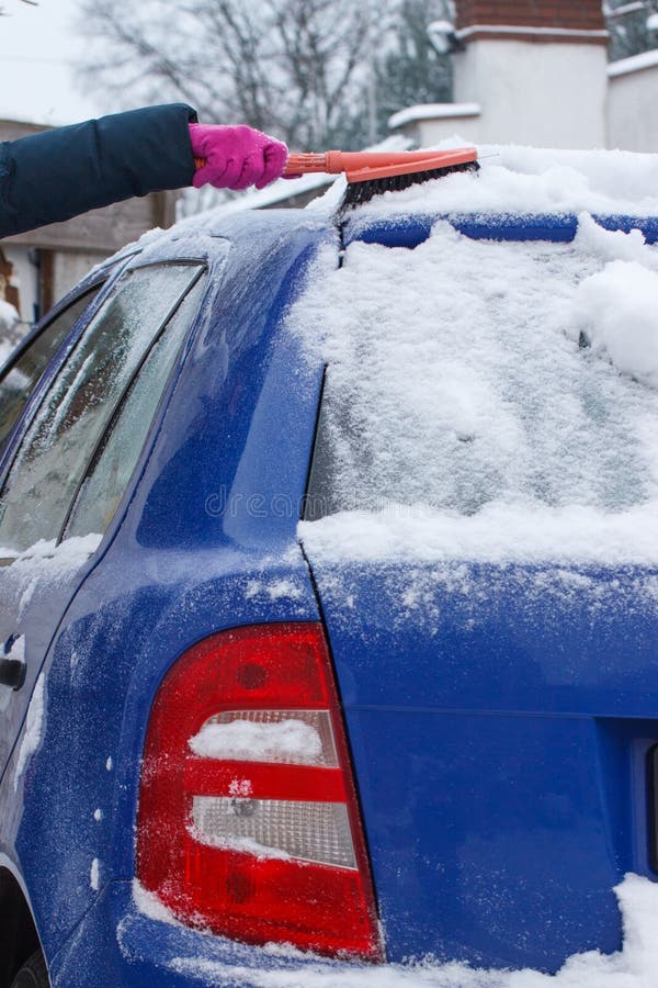Hand of Woman Using Brush and Remove Snow from Car and Windscreen Stock ...