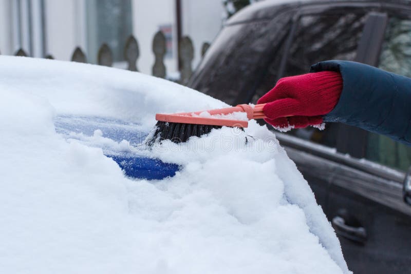 Hand of Woman Using Brush and Remove Snow from Car and Windscreen Stock ...