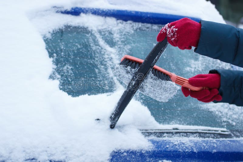Hand of Woman Using Brush and Remove Snow from Car and Windscreen Stock ...