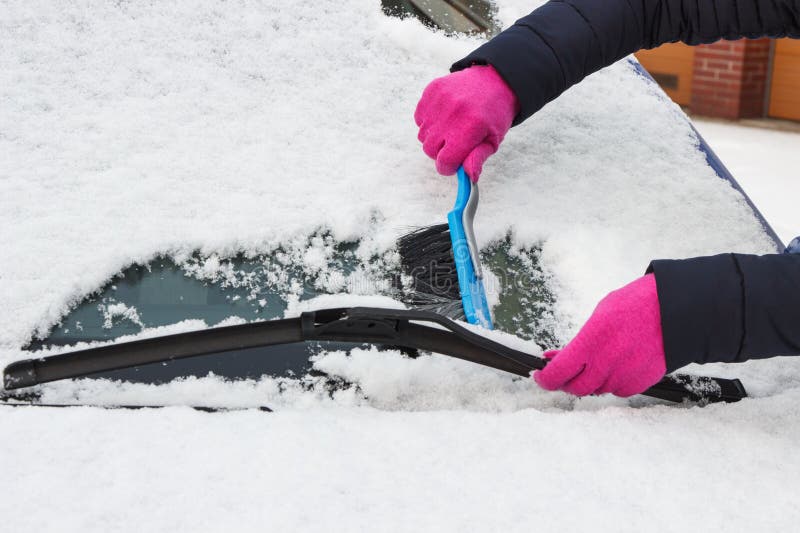 Hand of Woman Using Brush and Remove Snow from Car and Windscreen Stock ...