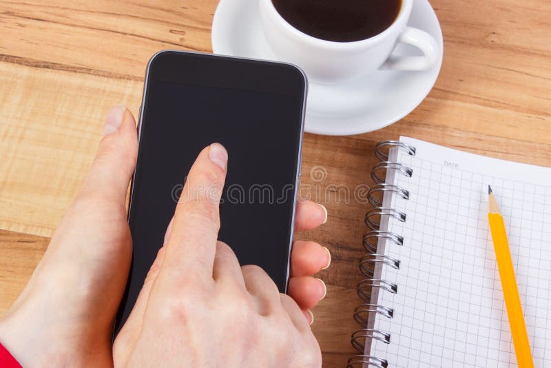 Hand of Woman Using Mobile Phone, Notepad for Writing Notes, Cup of ...