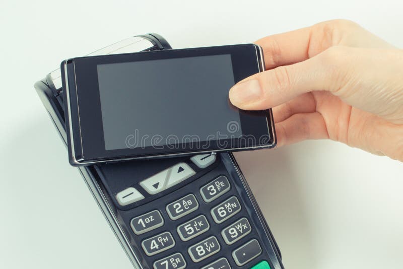 Hand Using Payment Terminal and Mobile Phone with NFC Technology ...