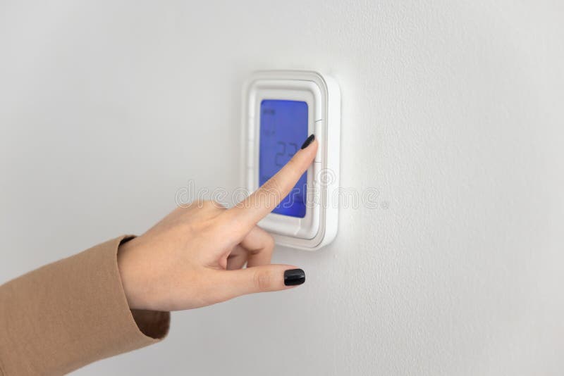 Hand of Woman Using Wall Mounted Smart Home Device Stock Photo - Image ...