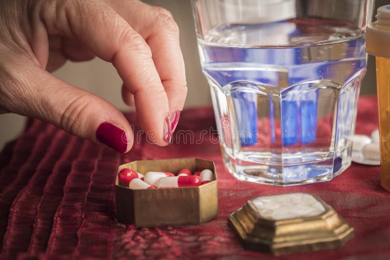 Hand Women Take Capsules Red and White Stock Image - Image of industry ...