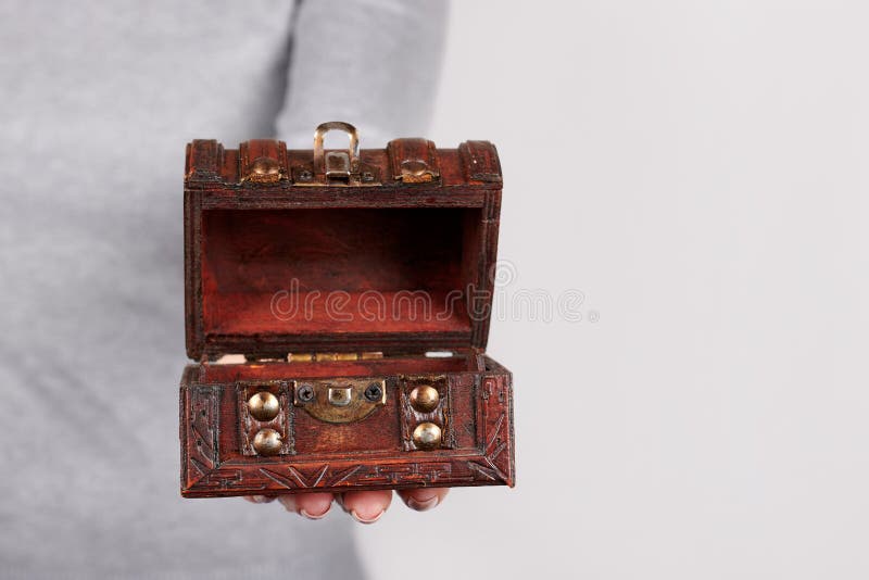 Hand with Wooden Chest on Grey Background Stock Photo - Image of hold ...