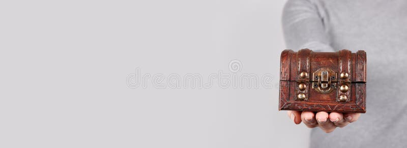 Hand with Wooden Chest on Grey Background Stock Image - Image of ...
