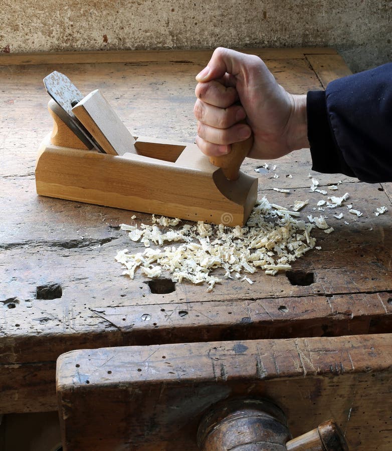 Hand of Worker in the Carpentry Workshop with a Plane Stock Photo ...