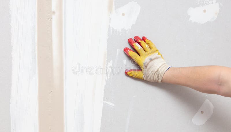 Hand of a Worker with Gloves on a Plaster Wall Stock Photo - Image of ...
