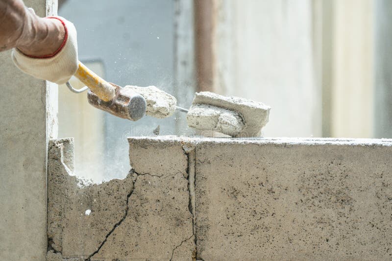 Hand of Worker Using Hammer Smashing and Demolish on Brick Wall at ...