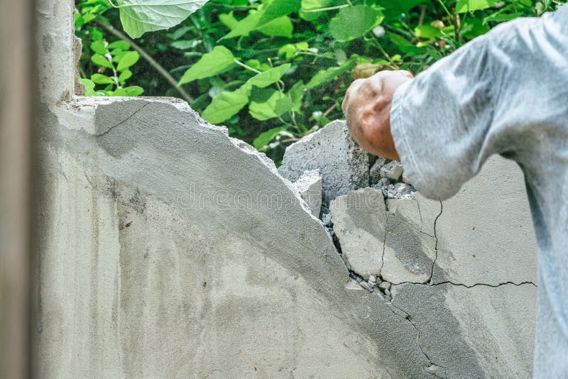 Hand of Worker Using Hammer Smashing and Demolish on Brick Wall at ...