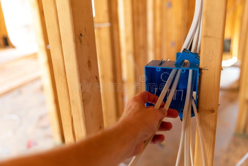 Hand Working on Electrical Wiring in New Home Construction Stock Photo ...