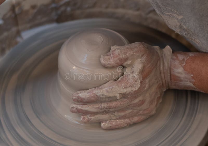 Hand Working a Piece of Clay on the Potter`s Wheel Seen from Above ...