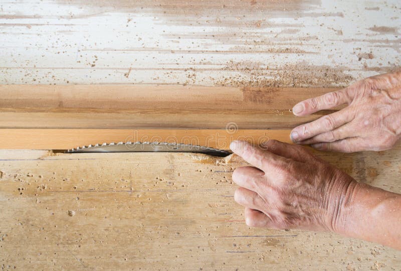 The Hand Working with the Rotating Saw Blade is High Speed and ...