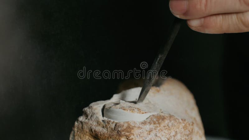 Hand Working Stone with Tool Isolated on Black Background. Media ...