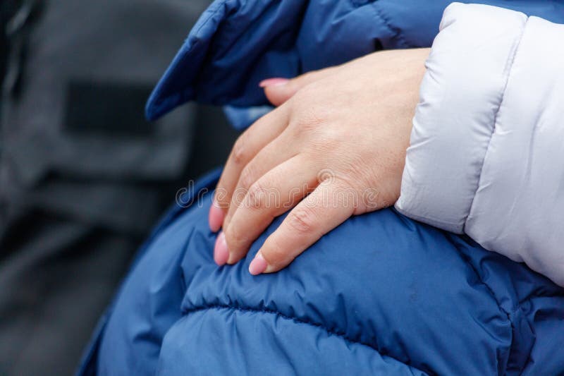 A Hand is Wrapped Around a Blue Jacket Stock Photo - Image of blue ...
