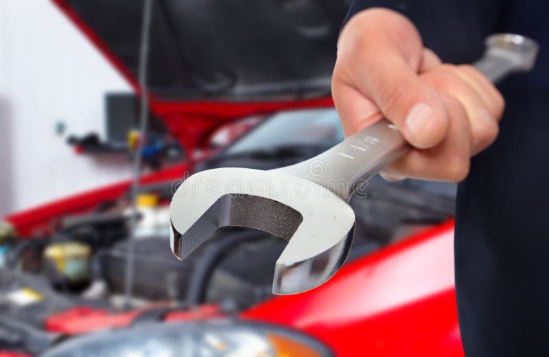 Auto Mechanic Hands Using Wrench To Repair a Car Engine. Stock Photo ...